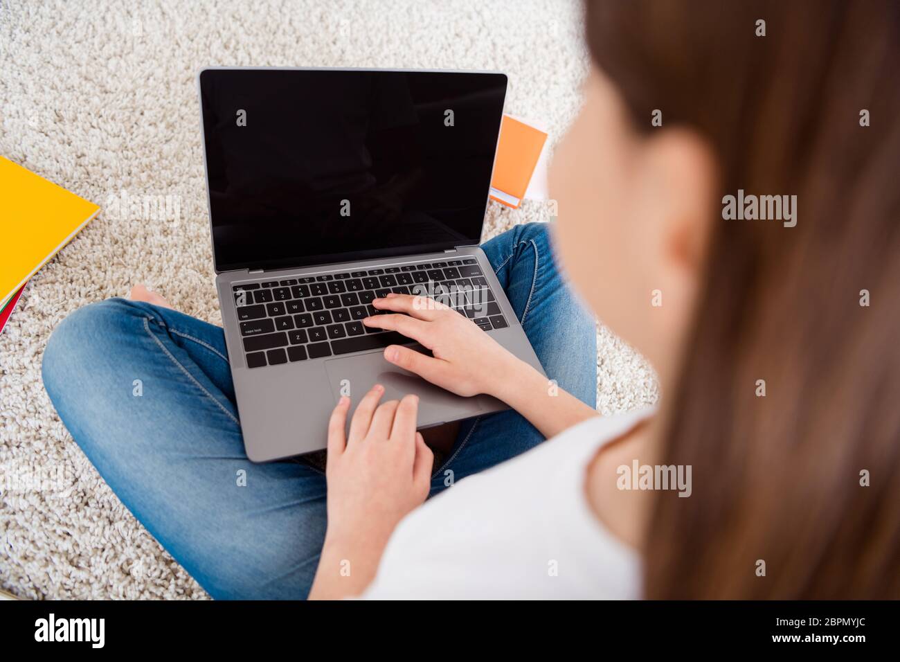 Back rear behind cropped view photo of small brunette school girl ...