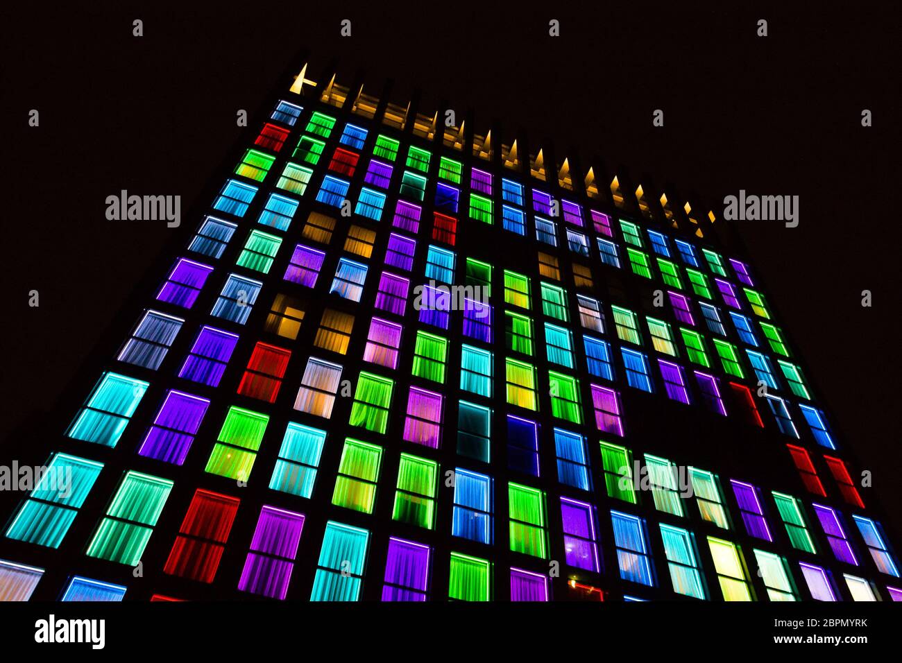 Colored windows texture. Windows illuminated by neon lights background ...