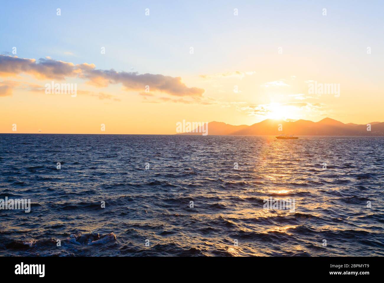 Sunset from the port of Cannes, France. Beautiful french panorama. Sun ...