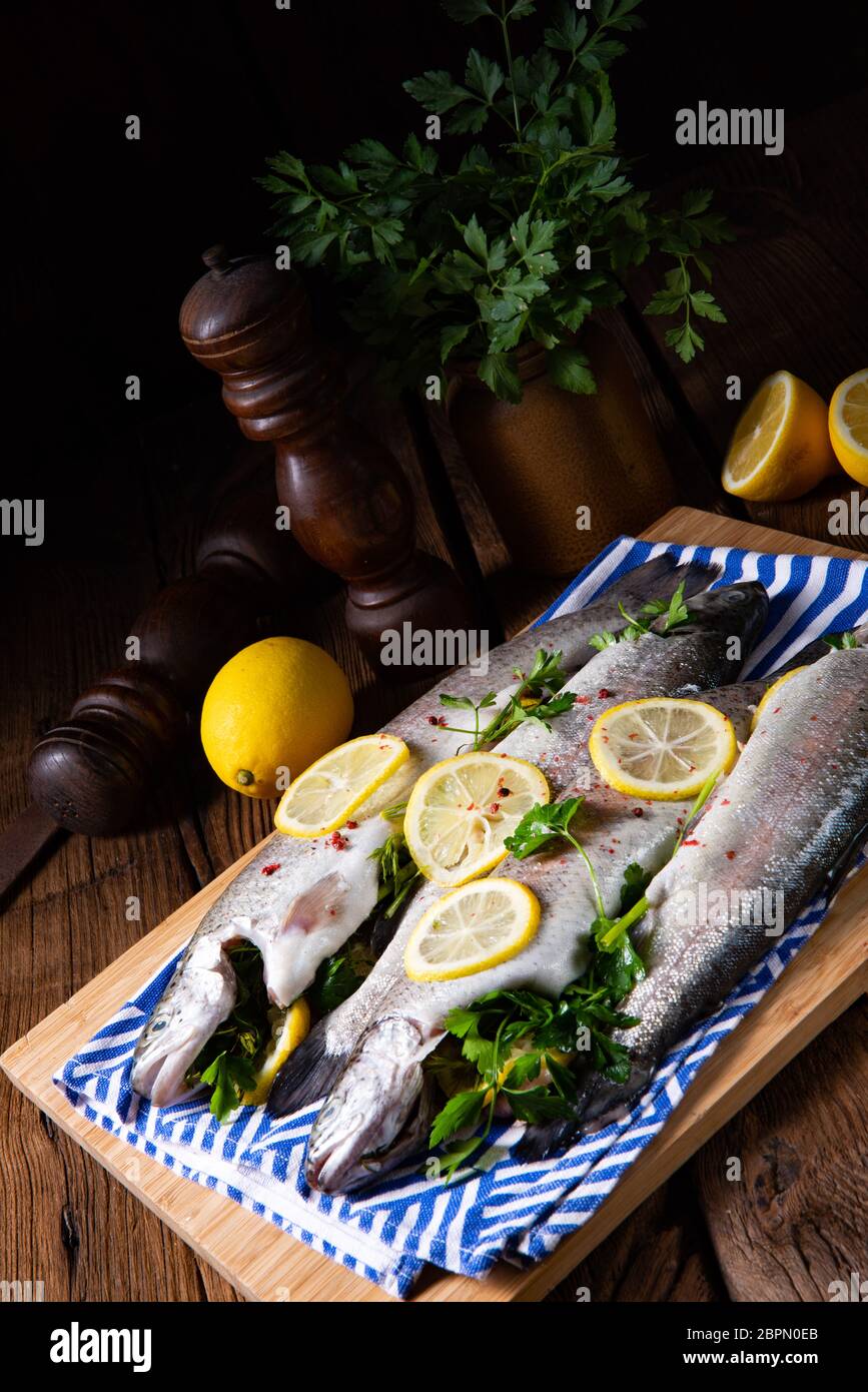 fresh trout with lemon and different herbs Stock Photo - Alamy