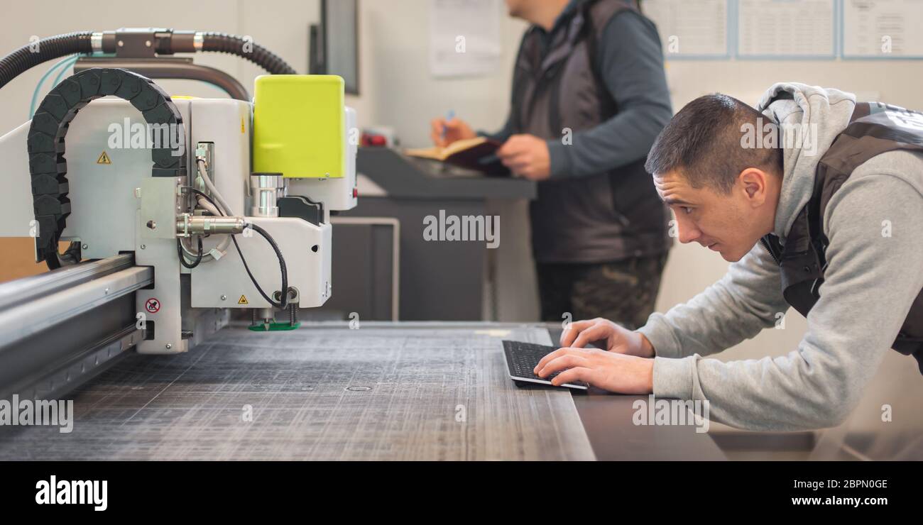 Modern robot works factory machine hi-res stock photography and images ...