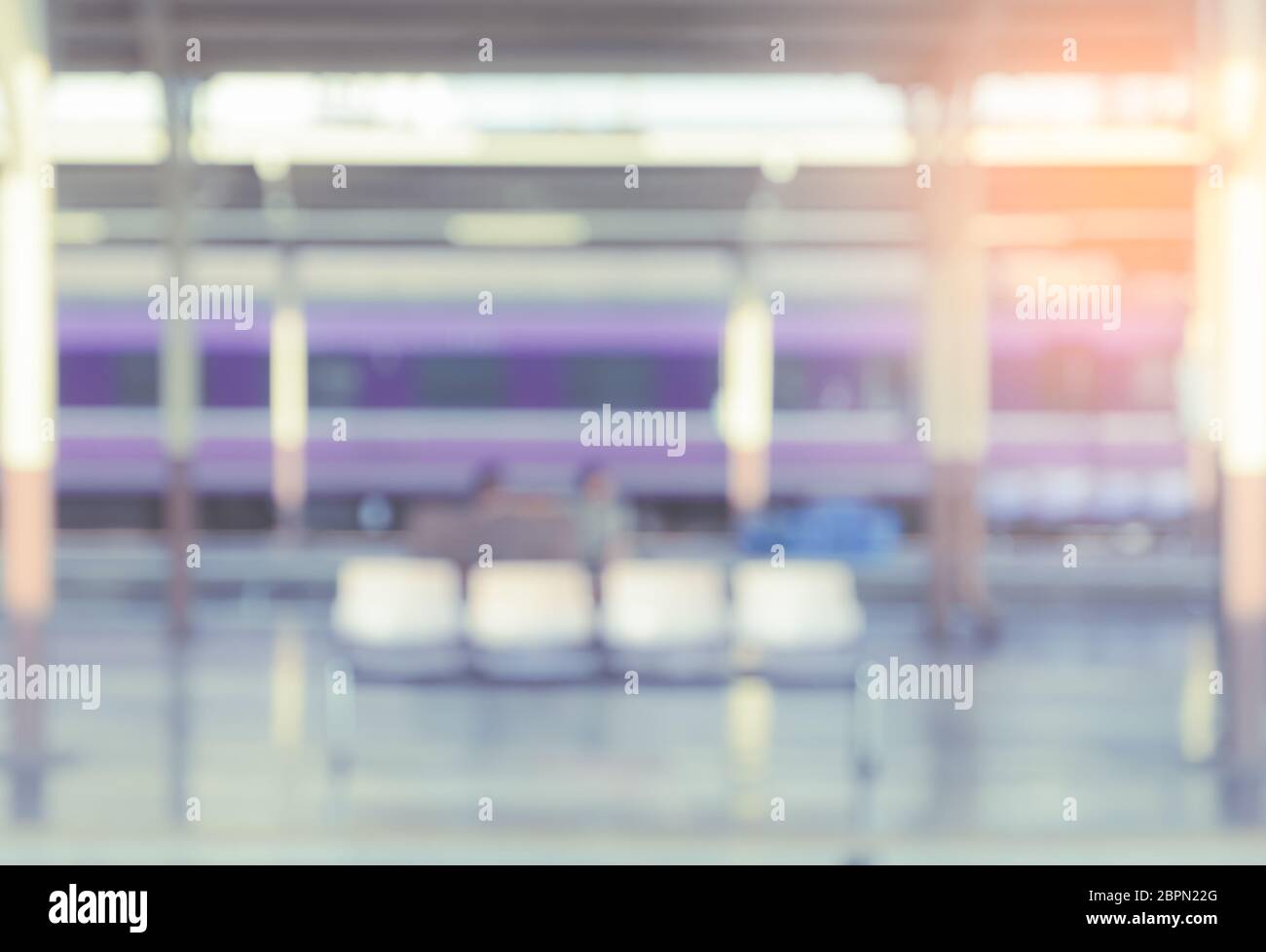 Railway platform with passenger train. Blurred train on railroad track ...