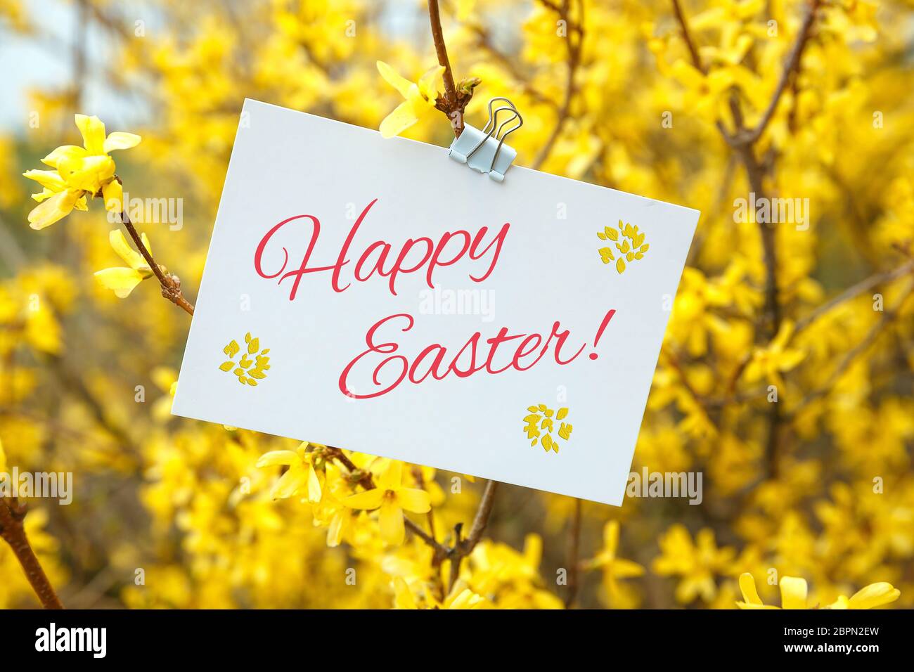 White card with the inscription Happy easter on a background of yellow ...