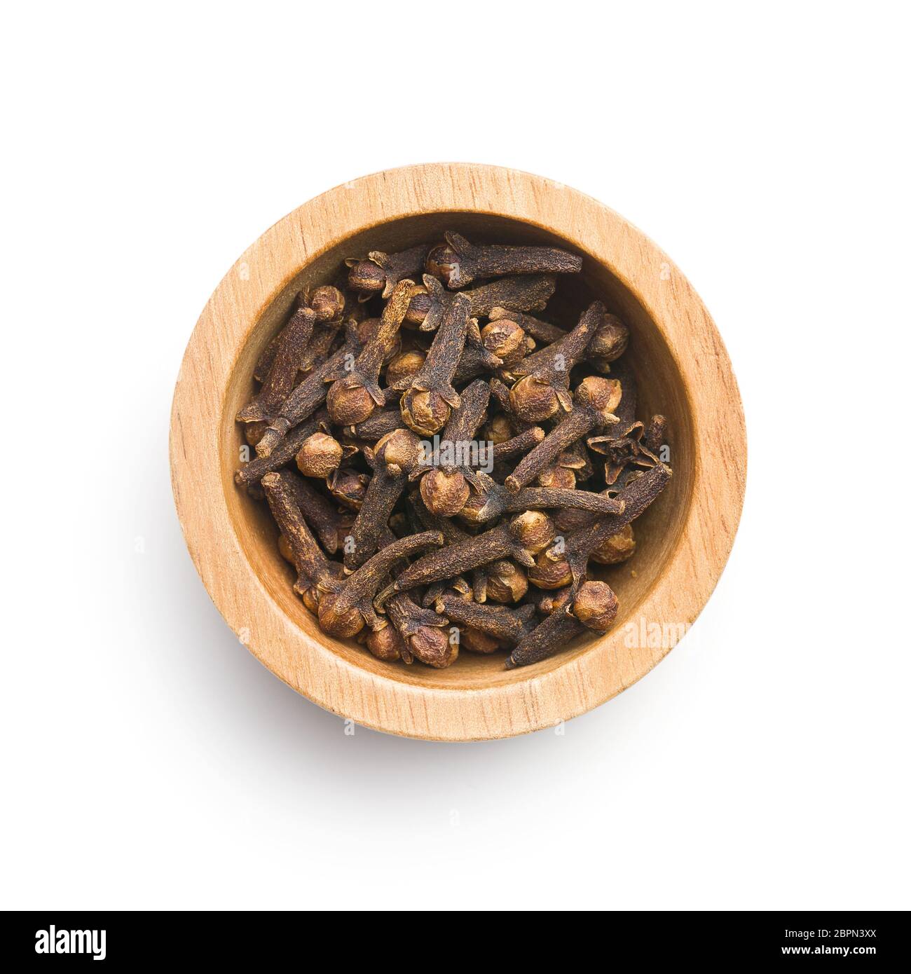 Carnation, dried clove spice in wooden bowl isolated on white ...