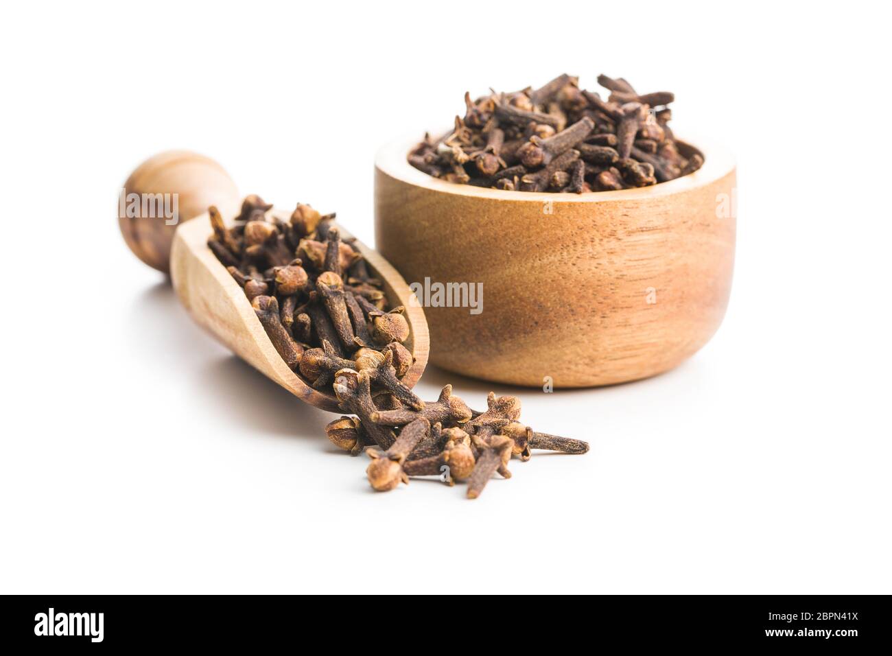 Carnation, dried clove spice in wooden scoop isolated on white ...