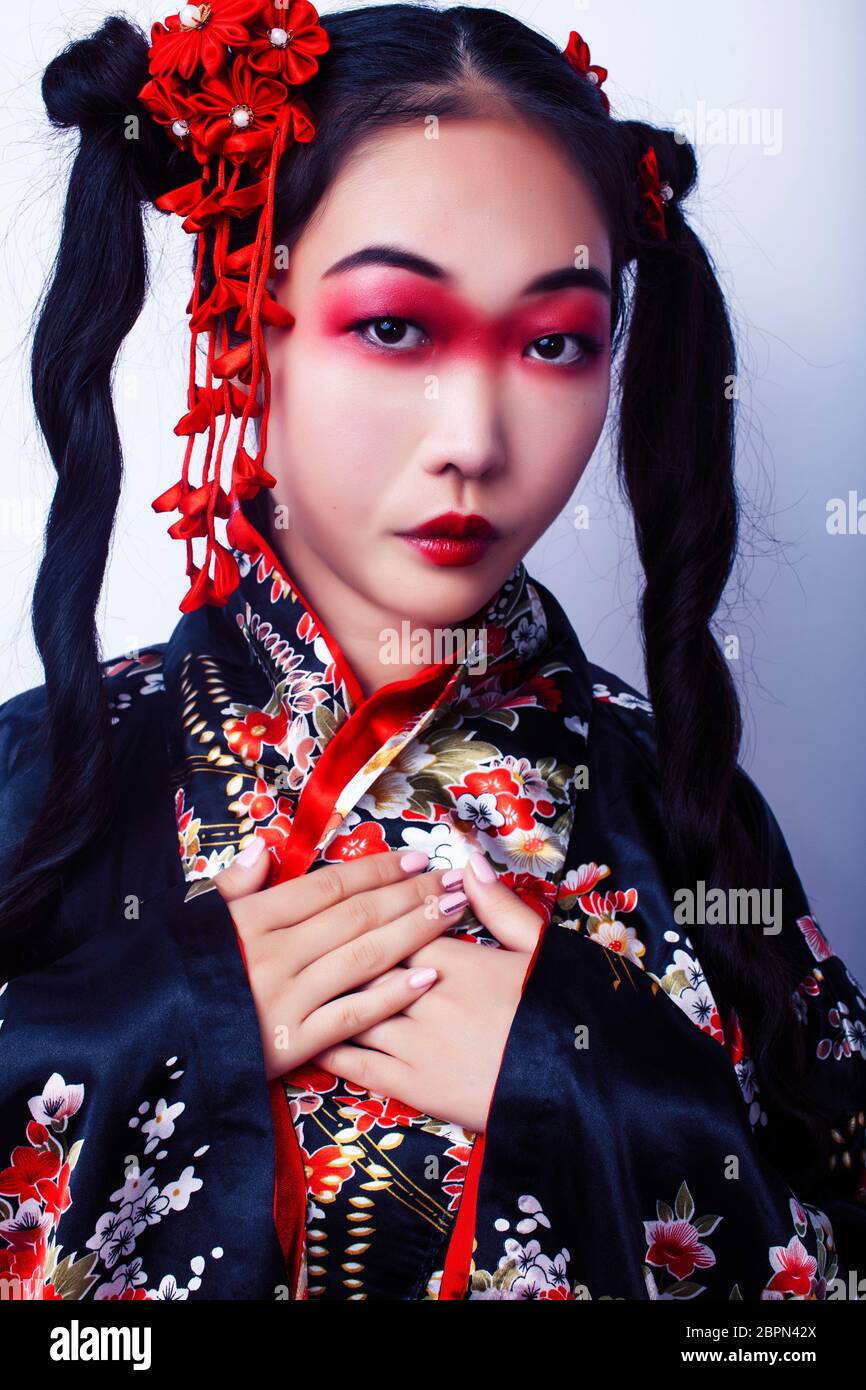young pretty geisha in black kimono with sakura, asian ethno closeup on ...
