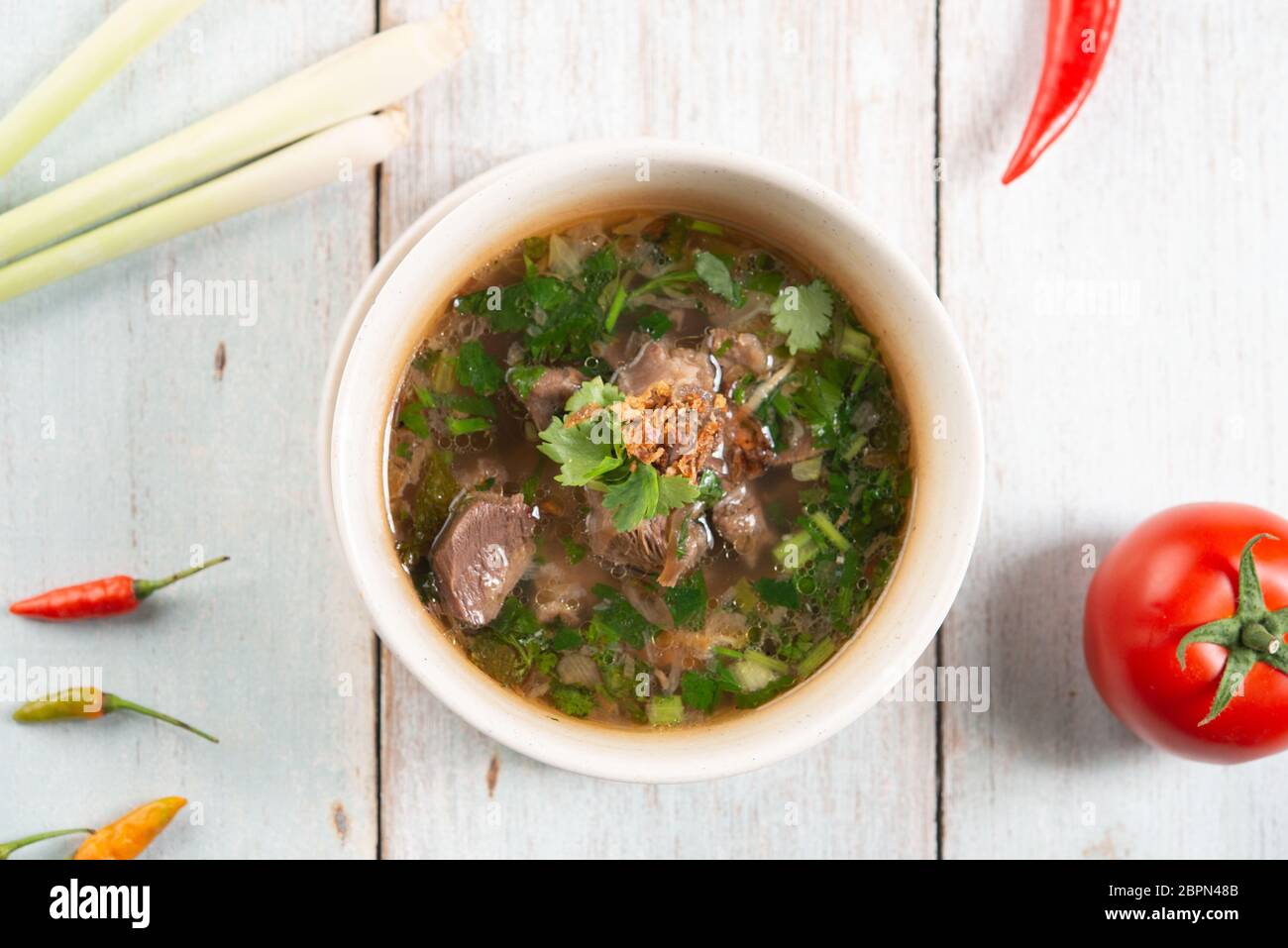 Asian bone soup or sup tulang, popular traditional malay dish. Top view ...