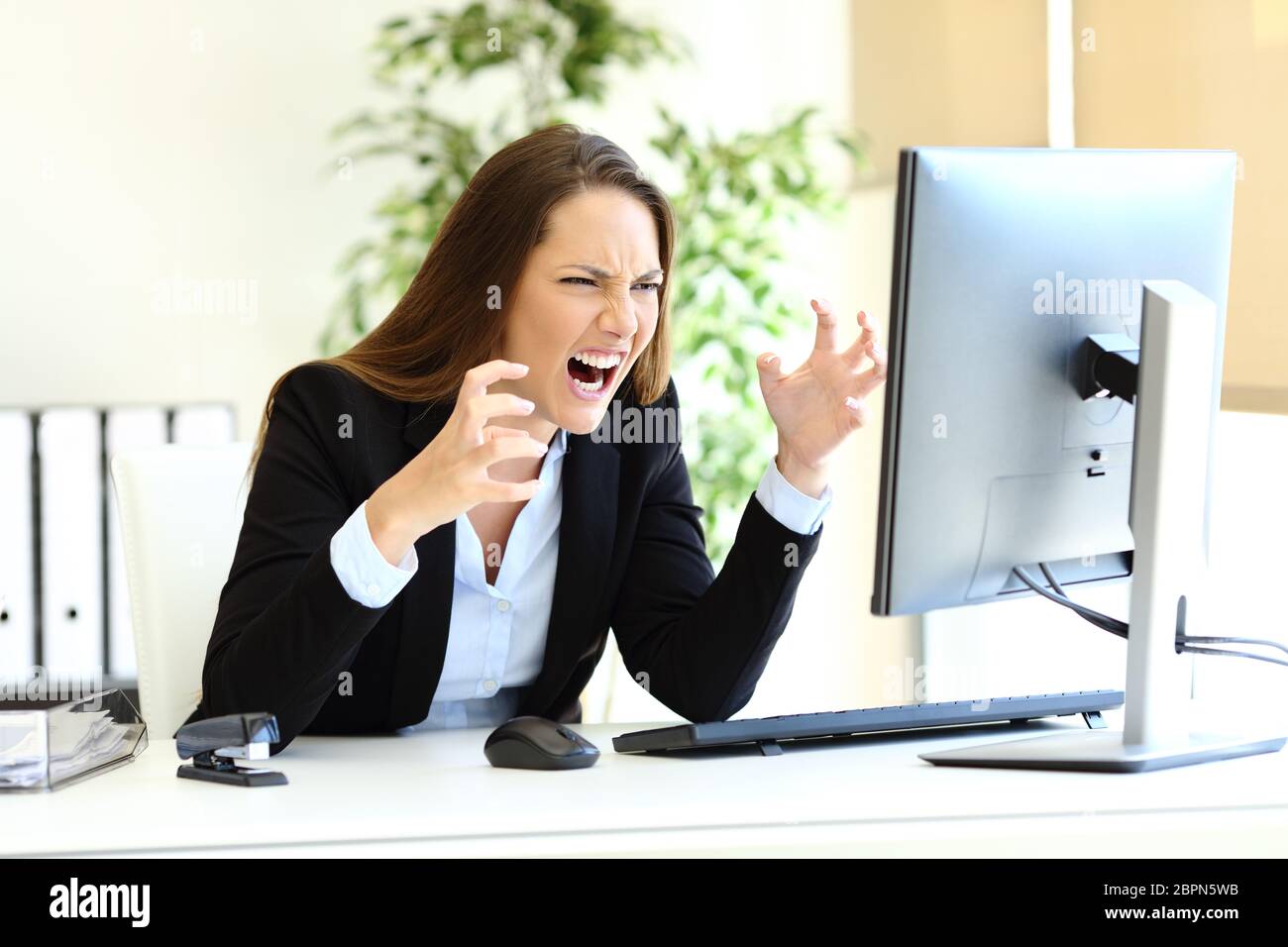 Angry office worker loosing control checking computer content Stock ...