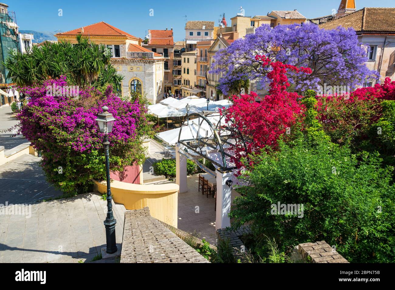Colorful flower filled plaza in Corfu Town in Greece Stock Photo - Alamy