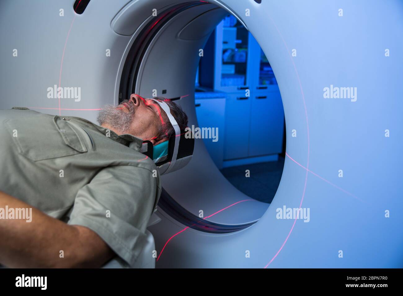 Healthcare Concept - Senior male patient undergoing a MRI examination ...