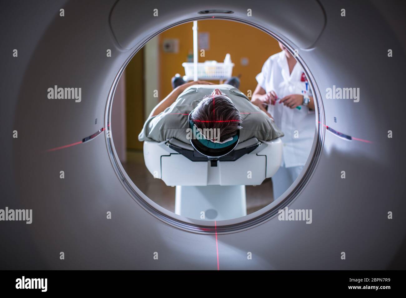 Healthcare Concept - Senior male patient undergoing a MRI examination ...