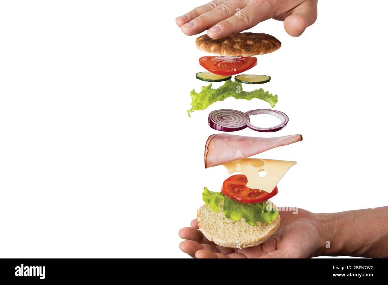 Close up view of homemade sandwich with flying ingredients isolated on ...