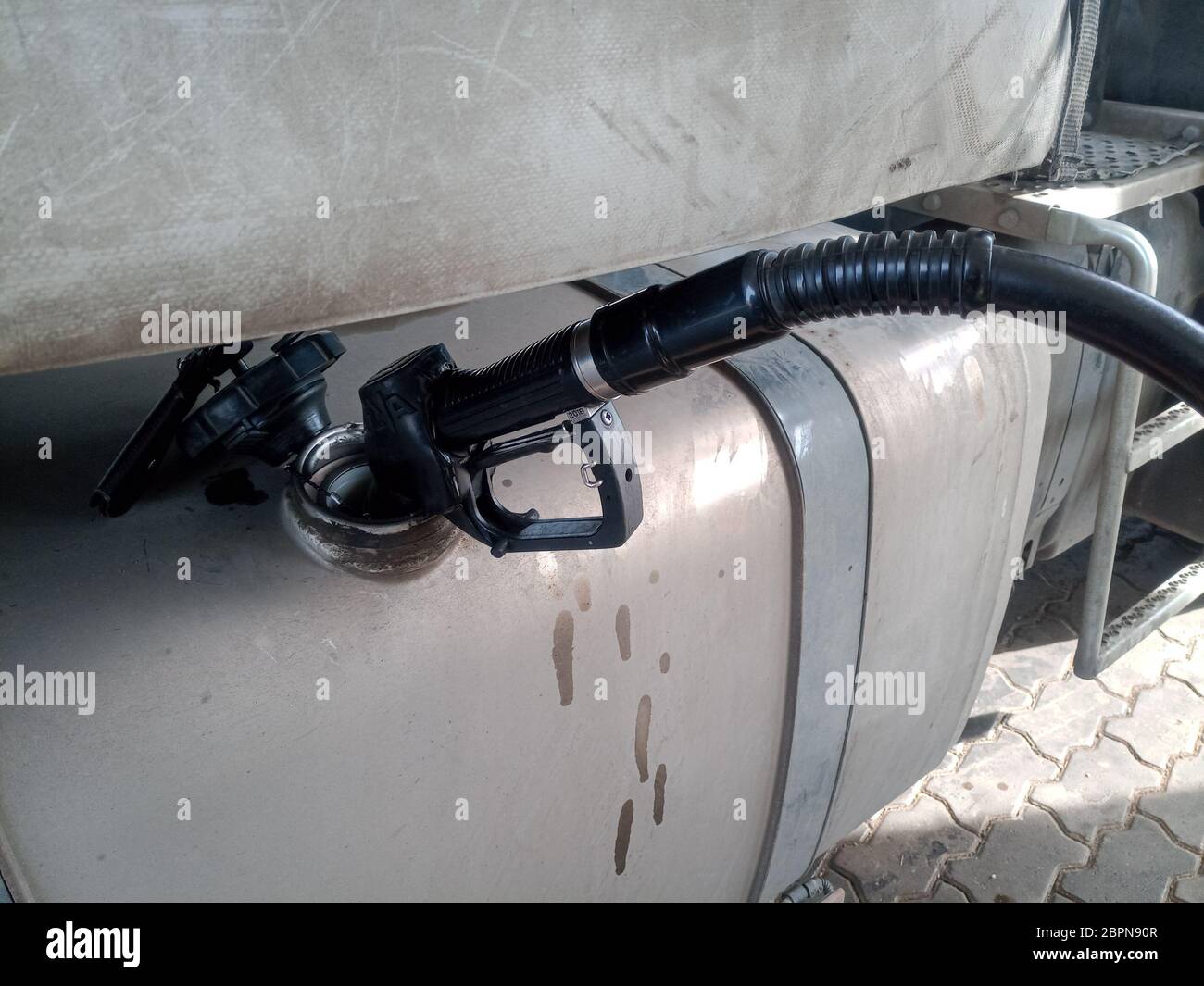 Diesel refueling gun in a truck tank Stock Photo - Alamy