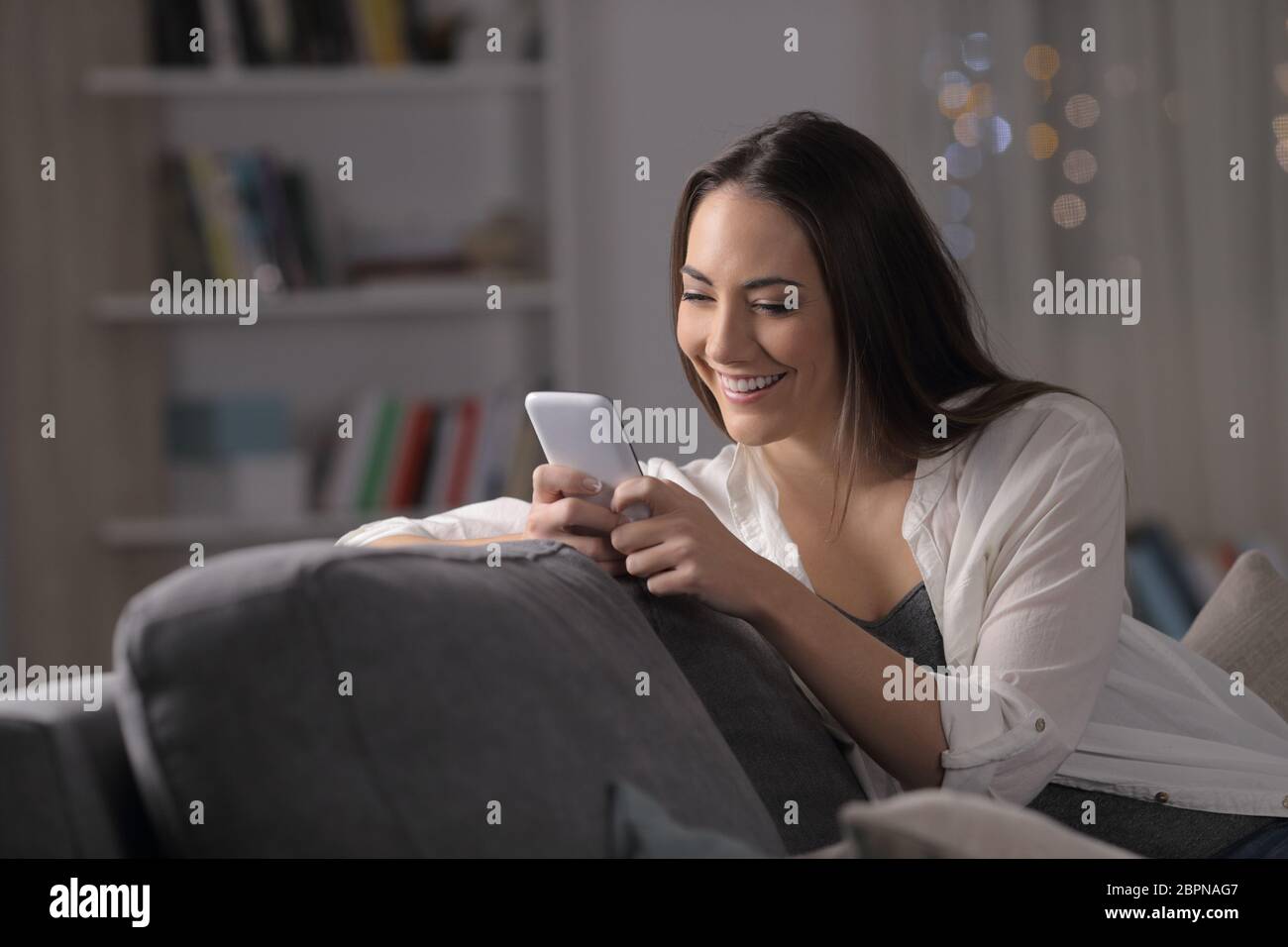 Texting watching tv text messaging hi-res stock photography and images ...