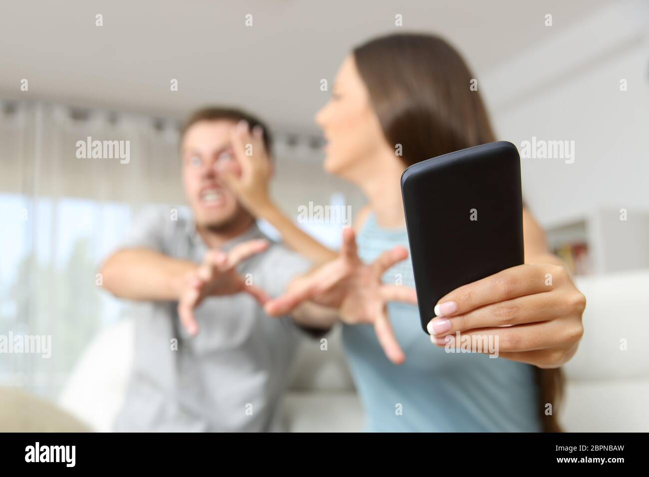 Angry couple or marriage fighting for a mobile phone at home Stock ...
