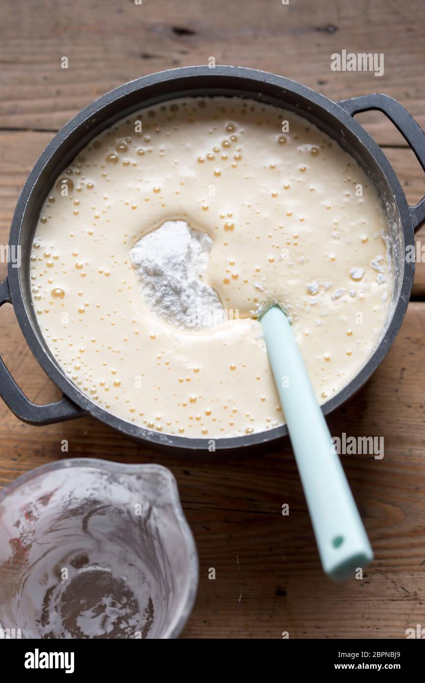 Preparing sponge batter , mixing flour Stock Photo - Alamy