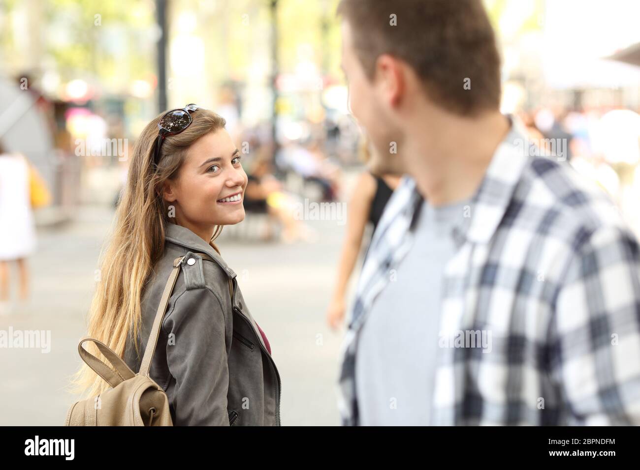 Strangers girl and guy flirting looking each other on the street Stock ...