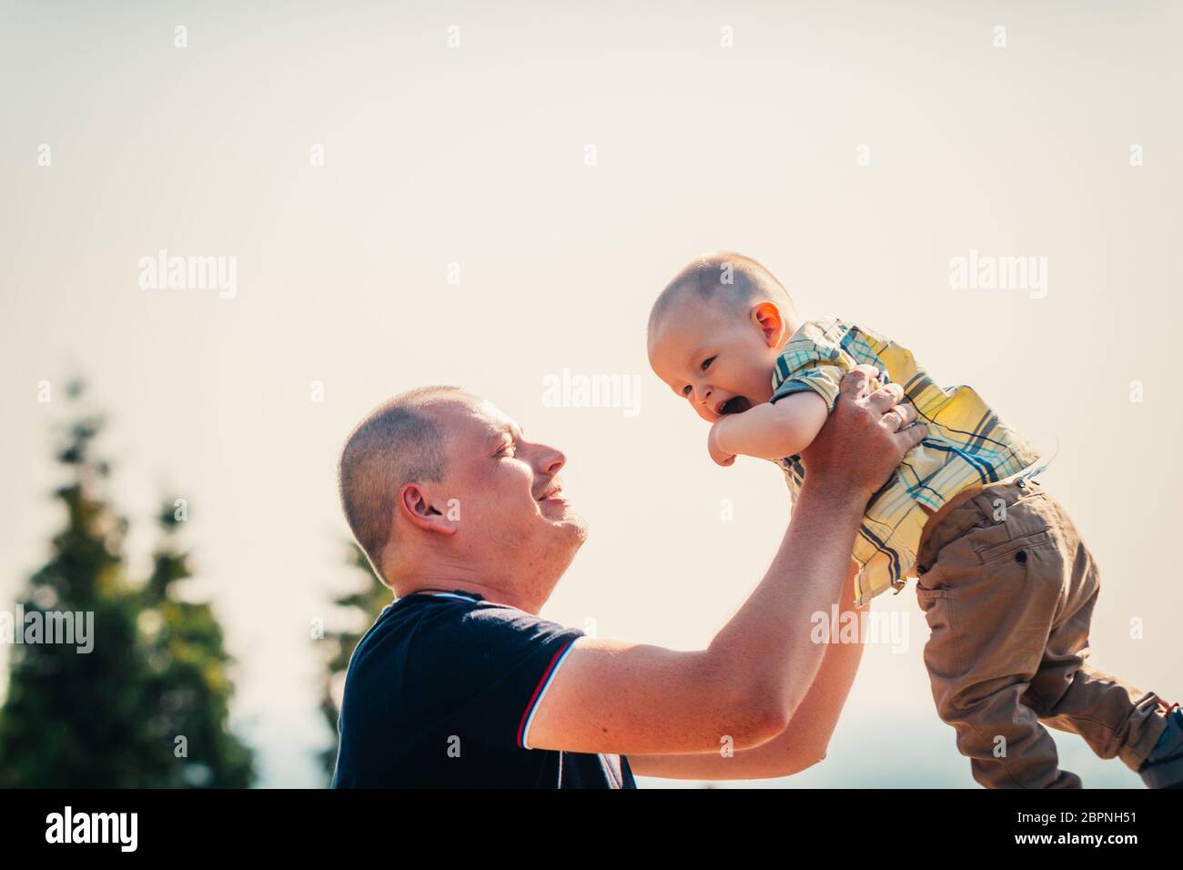 happy dad and baby on nature background Stock Photo - Alamy