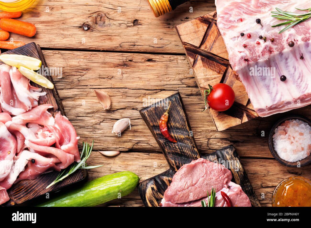 Fresh meat.Raw meat.Different types of raw meat on a wooden background ...