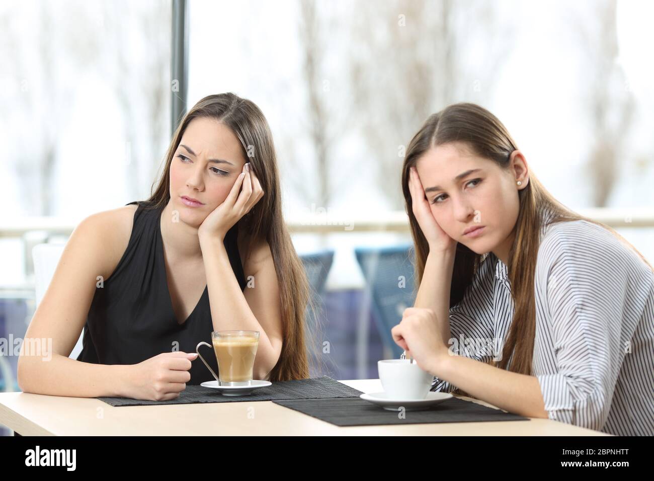 Two young teens ignoring hi-res stock photography and images - Alamy
