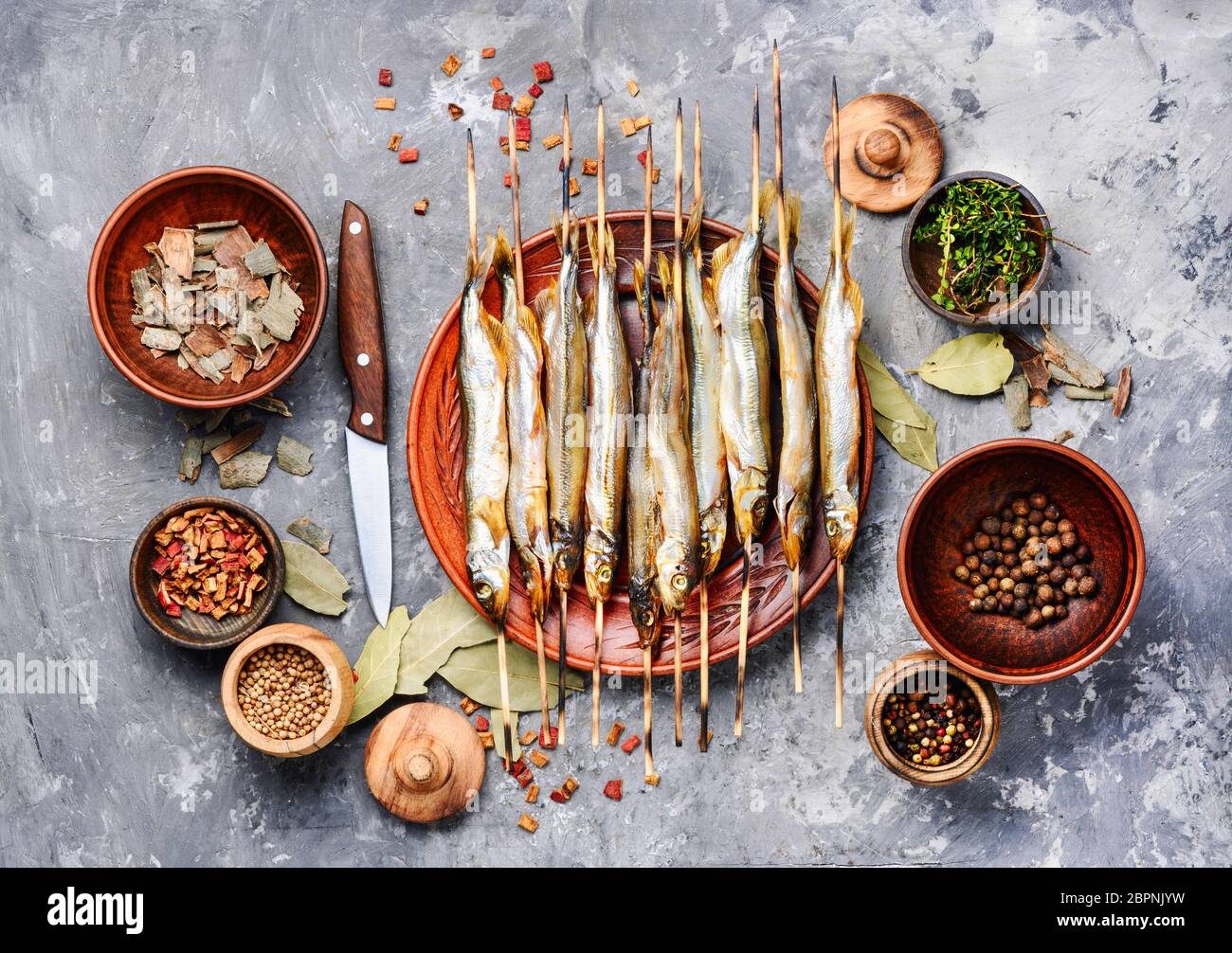Smoked fish with spices.Cold smoked fish.Smoked capelin Stock Photo - Alamy