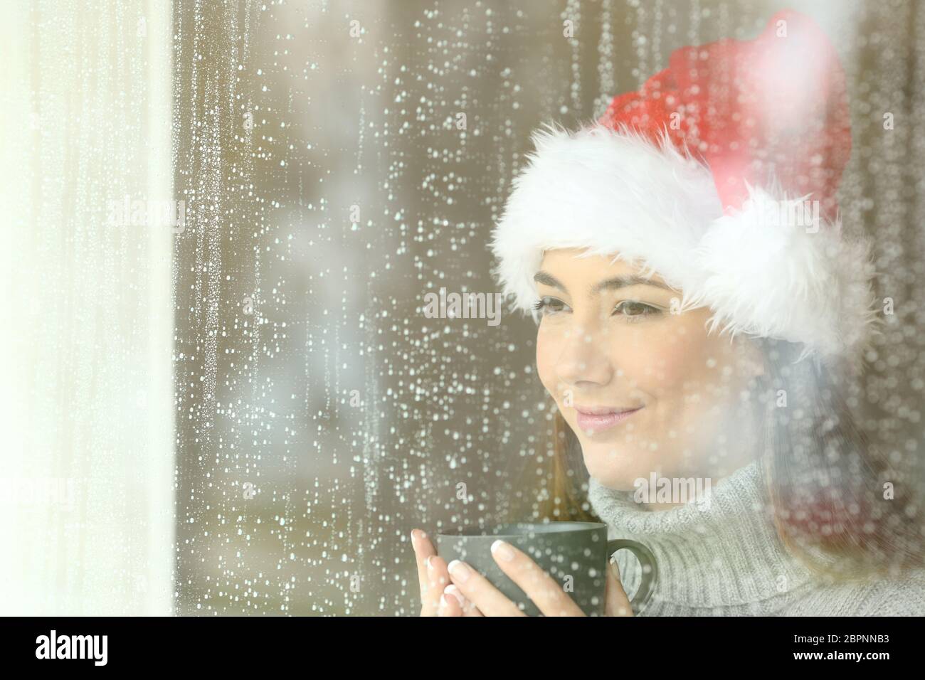 Santa claus looking through window hi-res stock photography and images ...