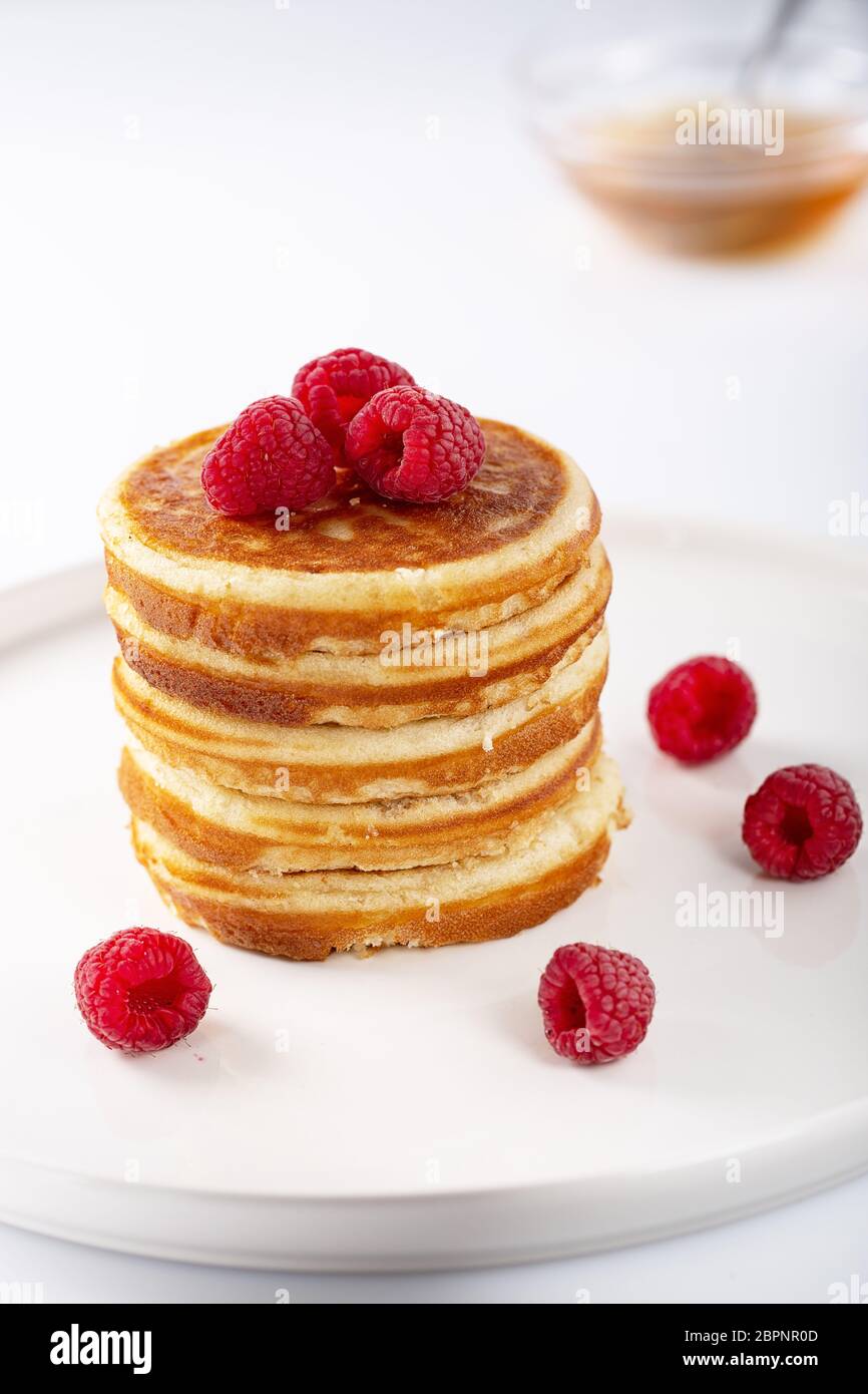 American Sweet homemade stack of pancakes or fritters with raspberry ...