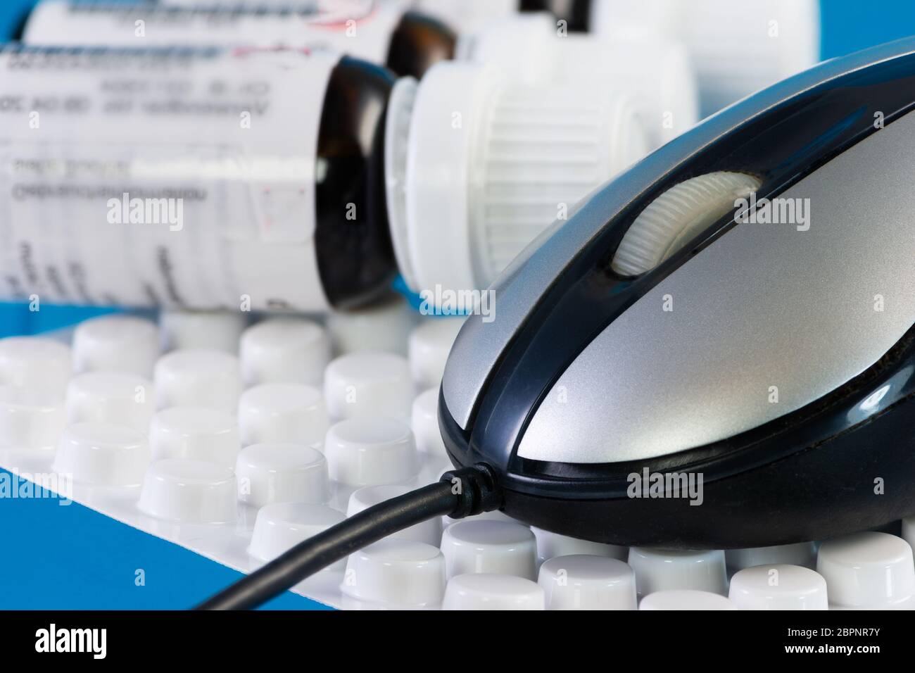Mouse and pills as symbol for online ordering of medicine in an ...