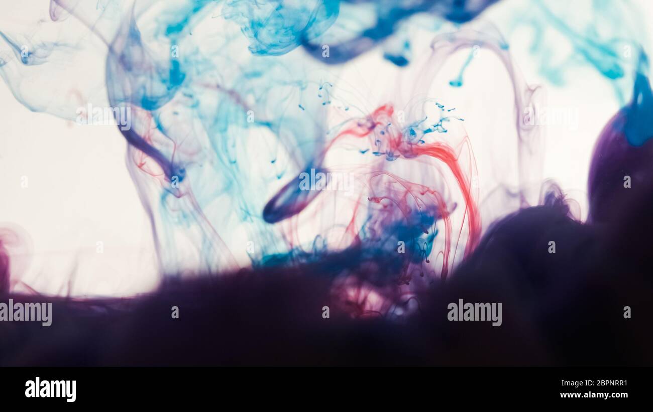 Cloud of color ink in water isolated on white. Abstract design and ...