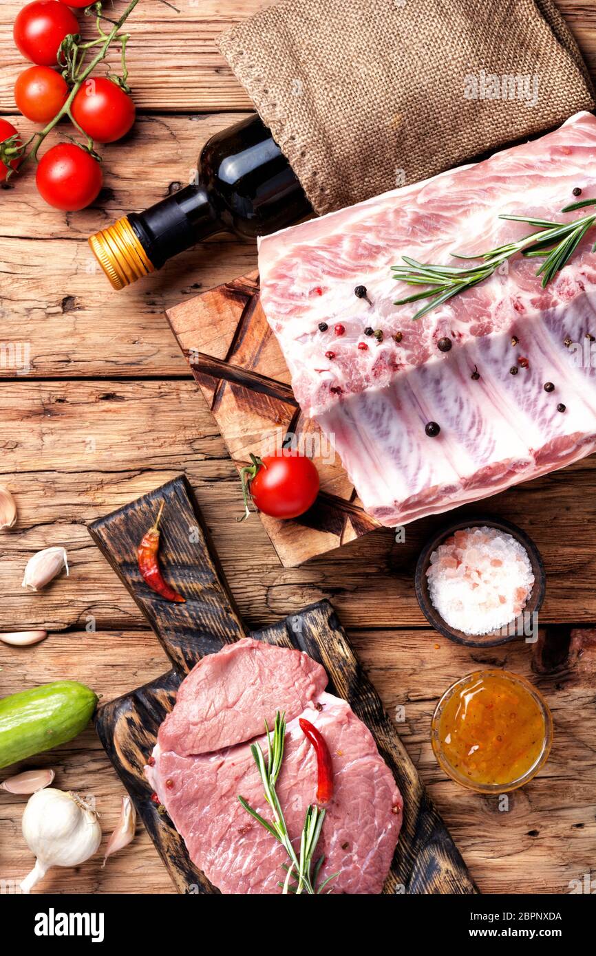Fresh meat.Raw meat.Different types of raw meat on a wooden background ...