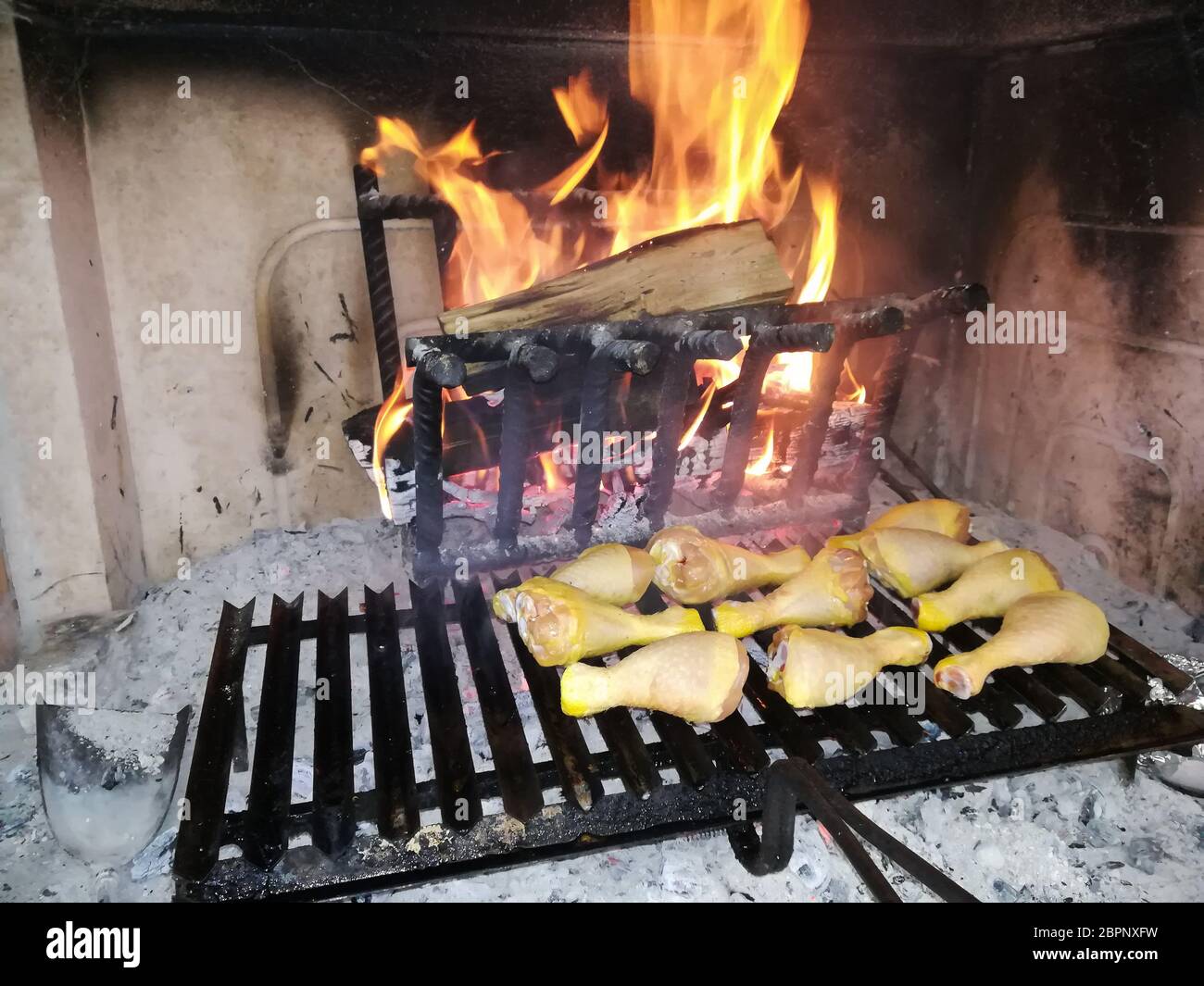 Grilled meat cooked on fireplace Stock Photo - Alamy