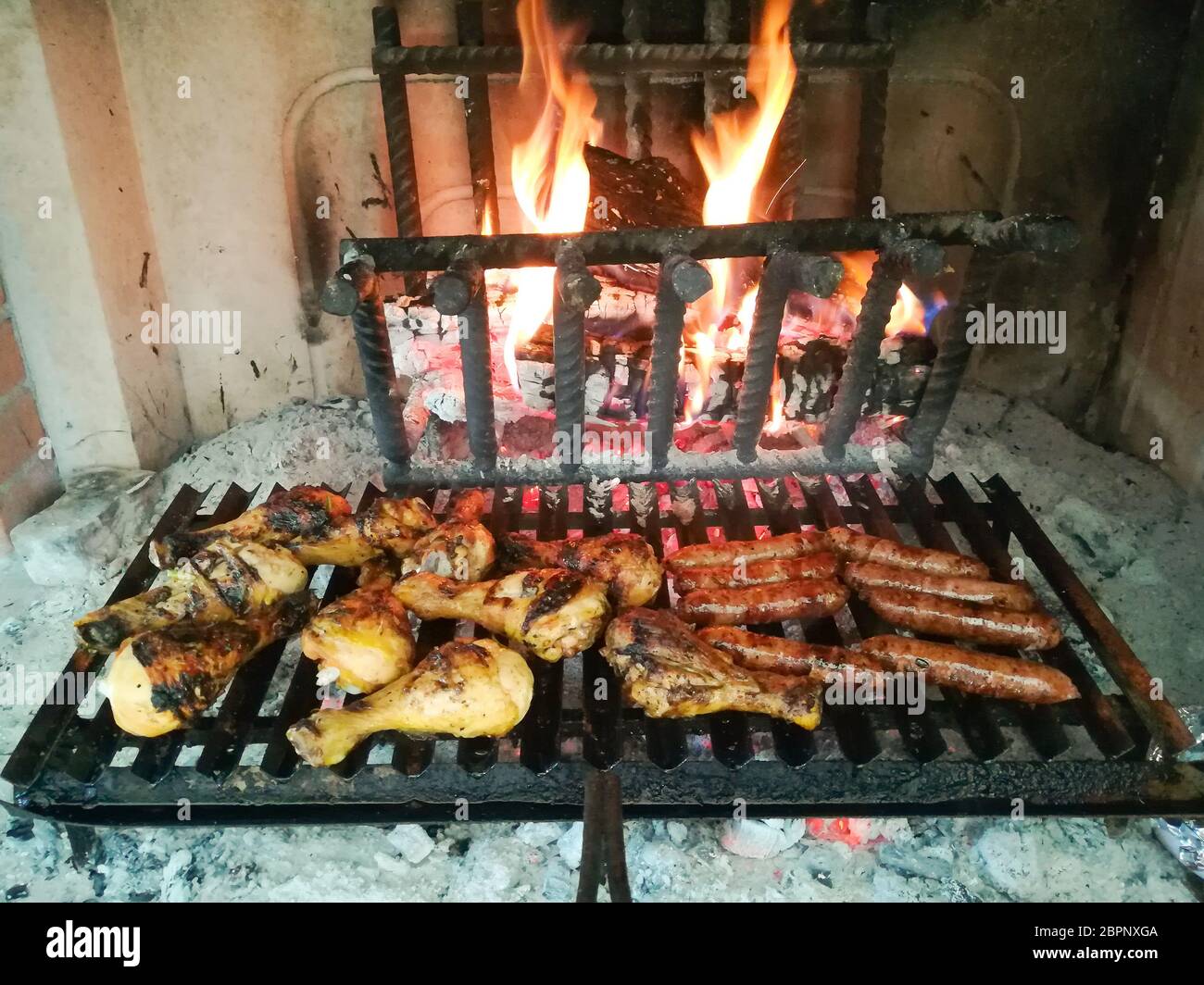 Grilled meat cooked on fireplace Stock Photo - Alamy