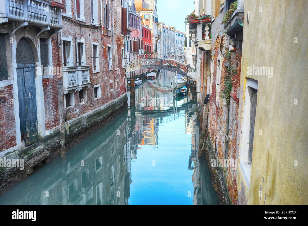 Canal in venice italy with small bridge Stock Photo - Alamy