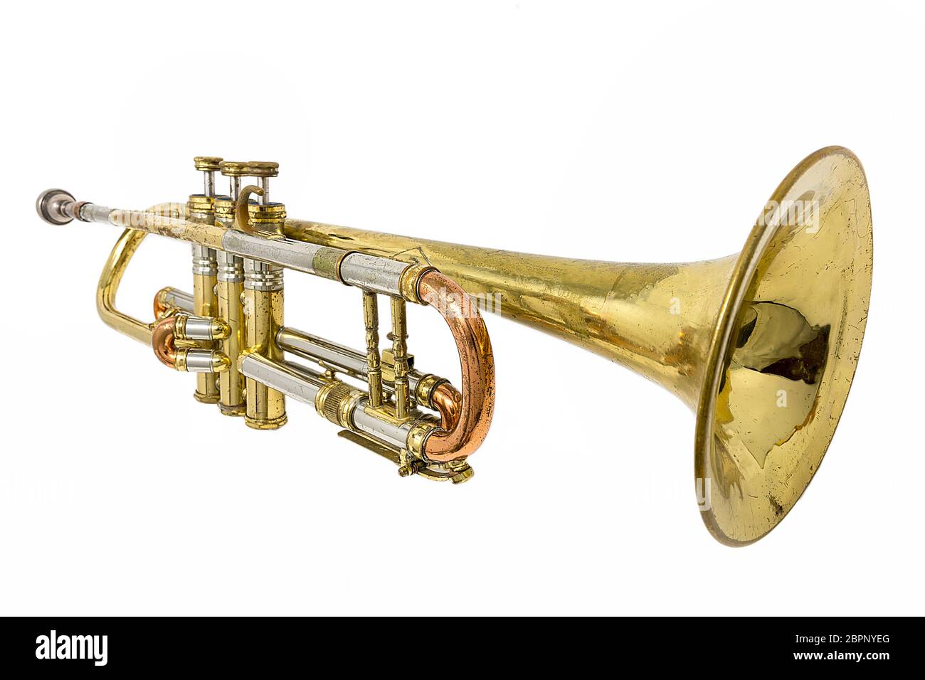 Old golden rusted trumpet with dents and scratches isolated on white ...