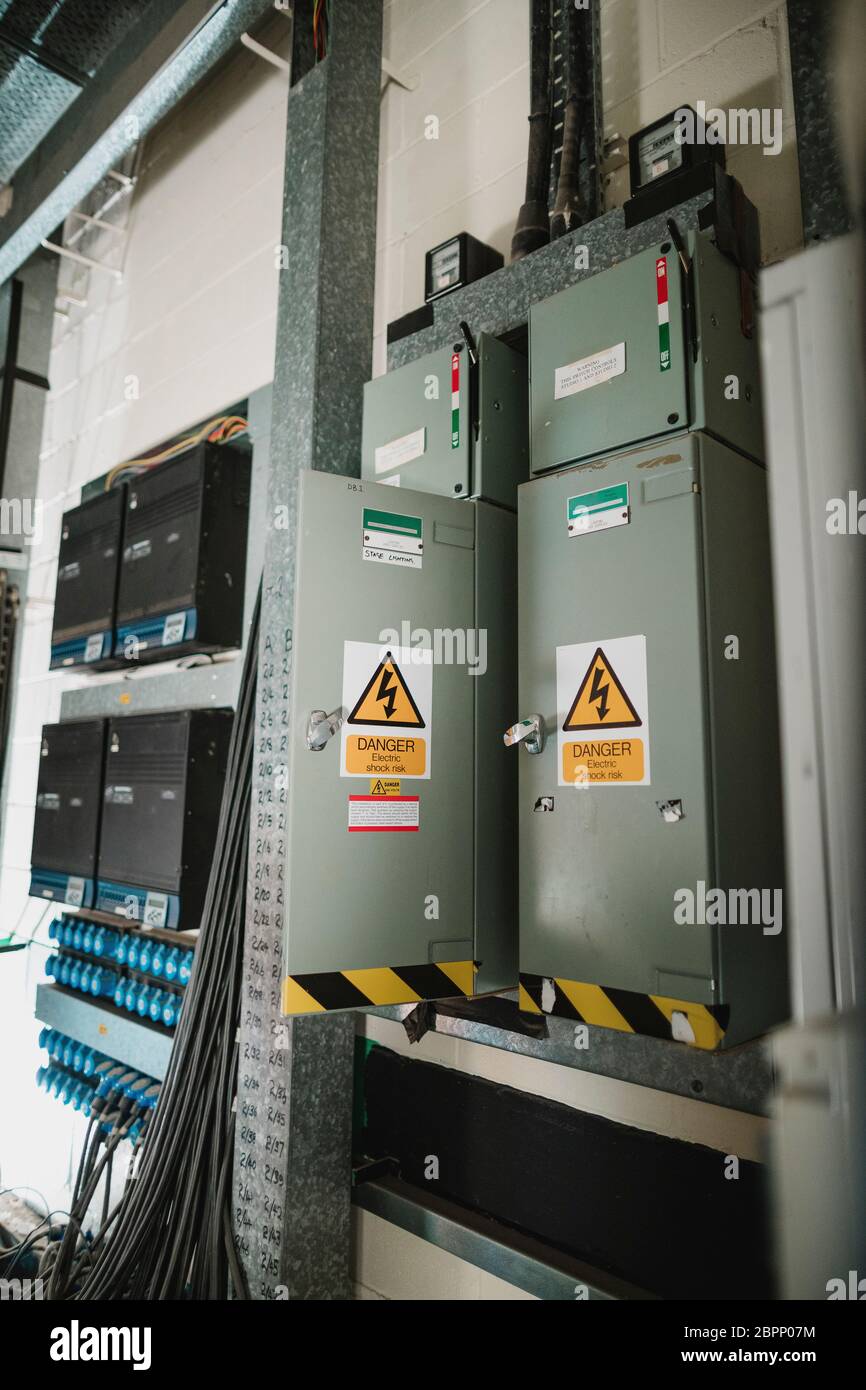 Close up shot of electrical enclosure boxes and power switches in the ...