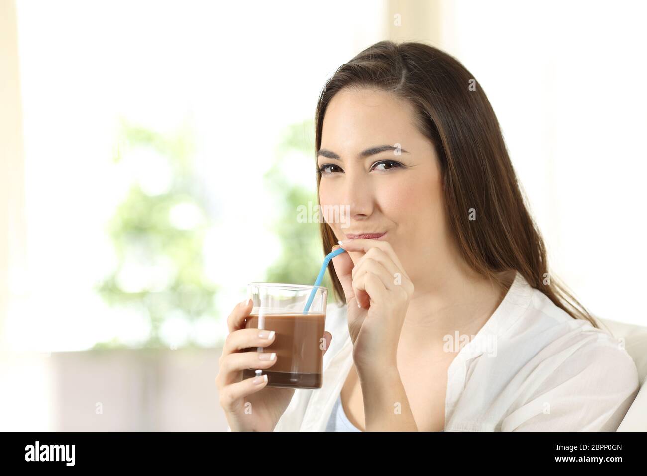 Sipping milk shake hi-res stock photography and images - Alamy