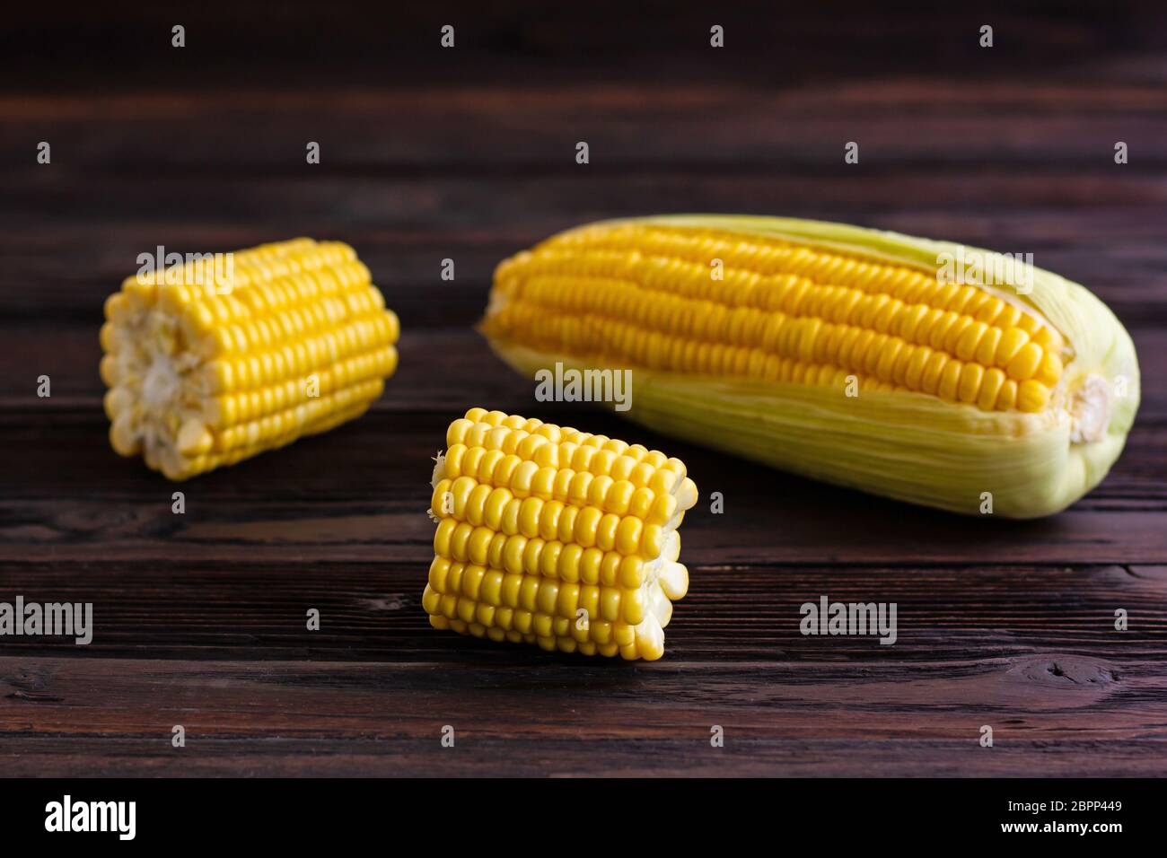 Sweet Corn on wooden table background Stock Photo - Alamy