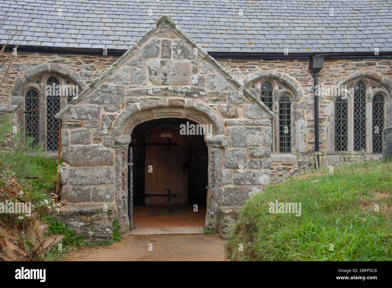 Entrance to the Parish Church of St Winwaloe in Gunwalloe, Cornwall ...