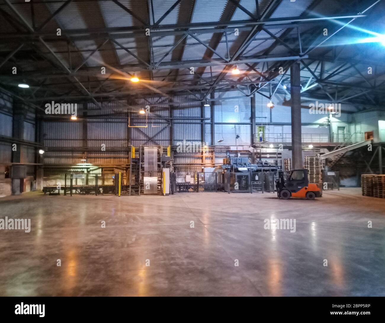 Pallet racks inside a cement plant. Loading shop of a cement plant ...