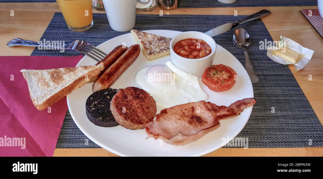 traditional irish breakfast with bacon, sausage, beans and other ...