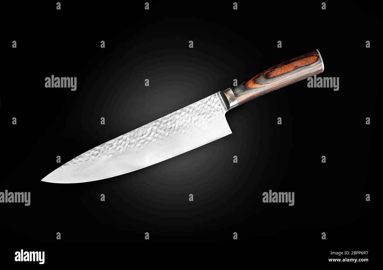 Chef's knife for your kitchen isolated on black background. With ...