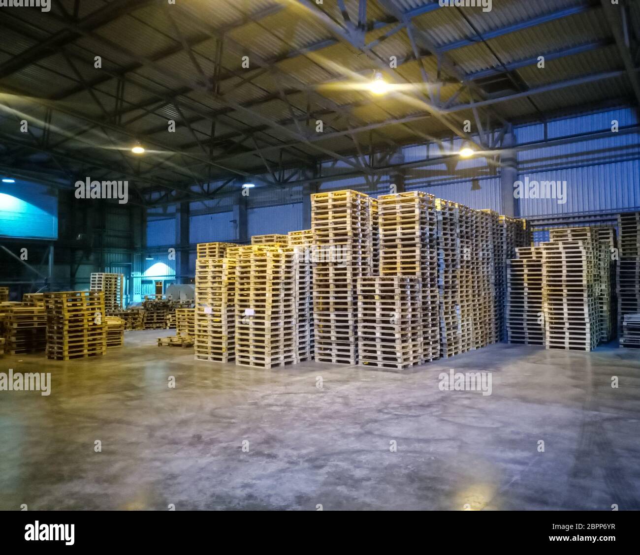 Pallet racks inside a cement plant. Loading shop of a cement plant ...