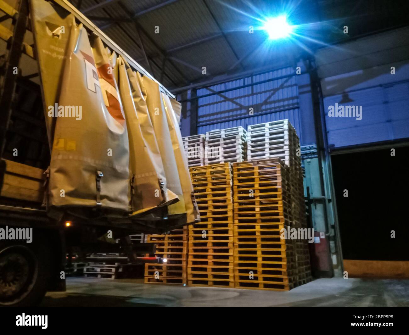 Pallet racks inside a cement plant. Loading shop of a cement plant ...