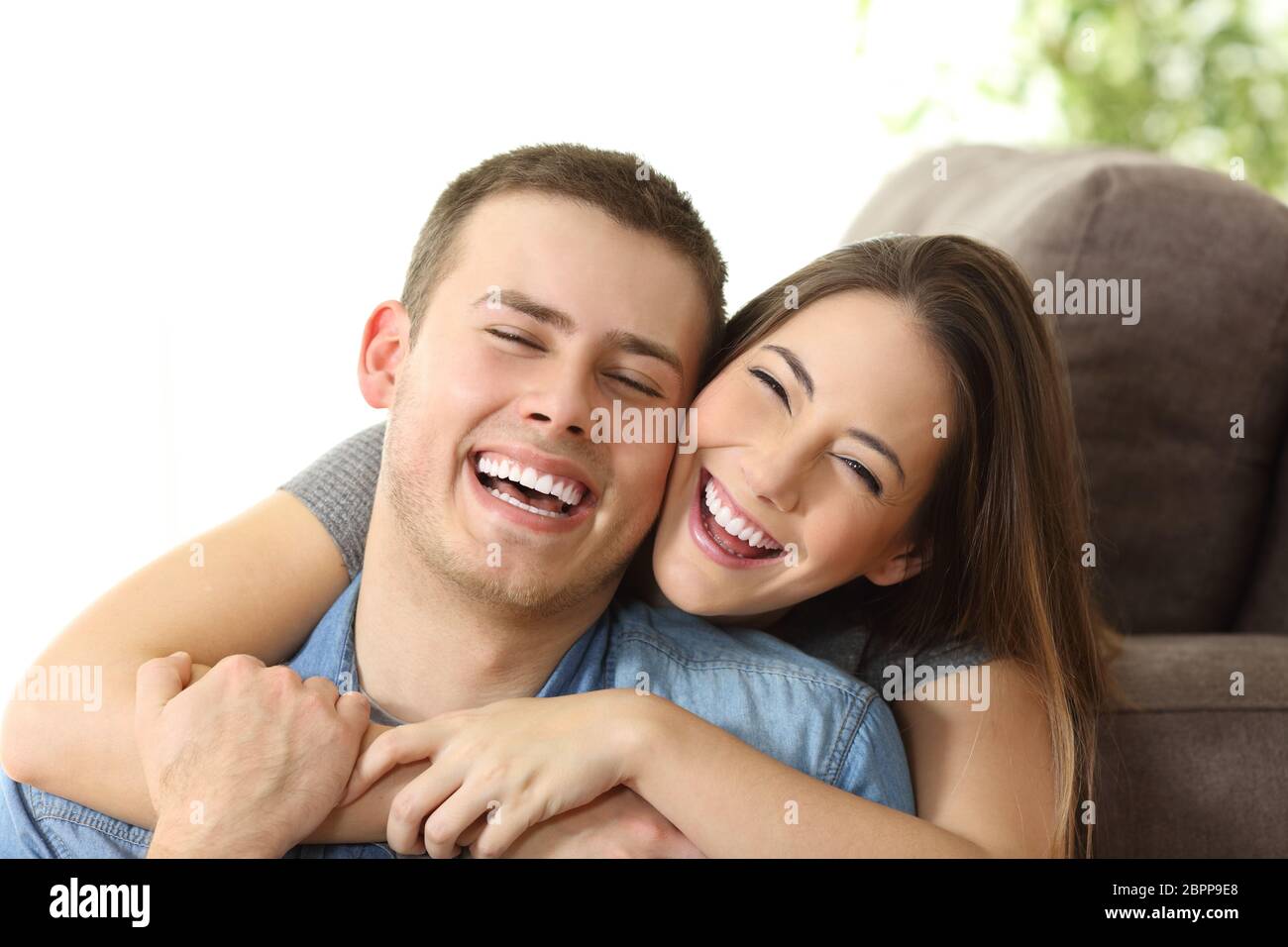 Happy couple with perfect white smile posing and looking at camera on a ...