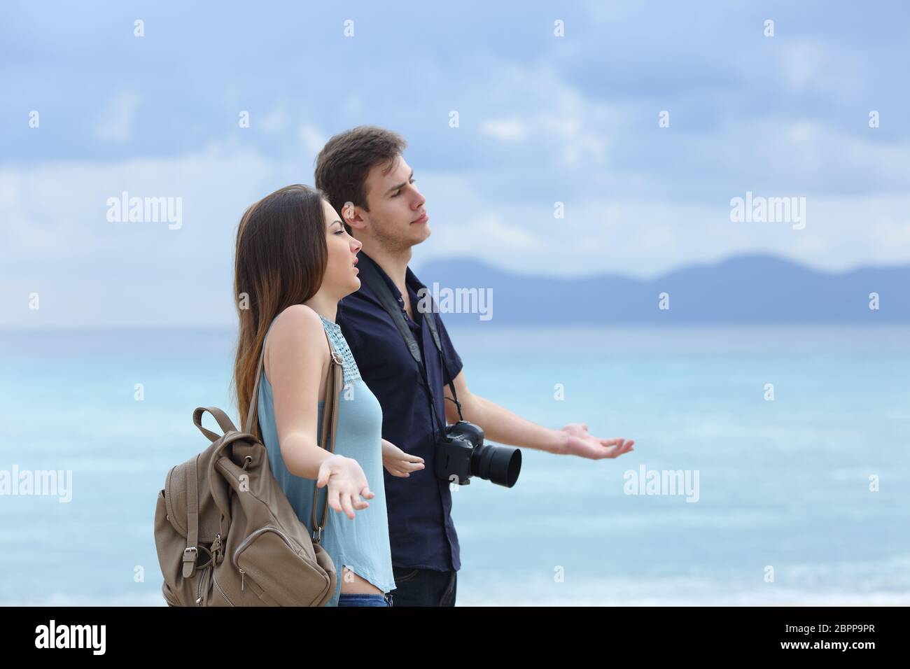 Woman holiday unhappy beach hi-res stock photography and images - Alamy