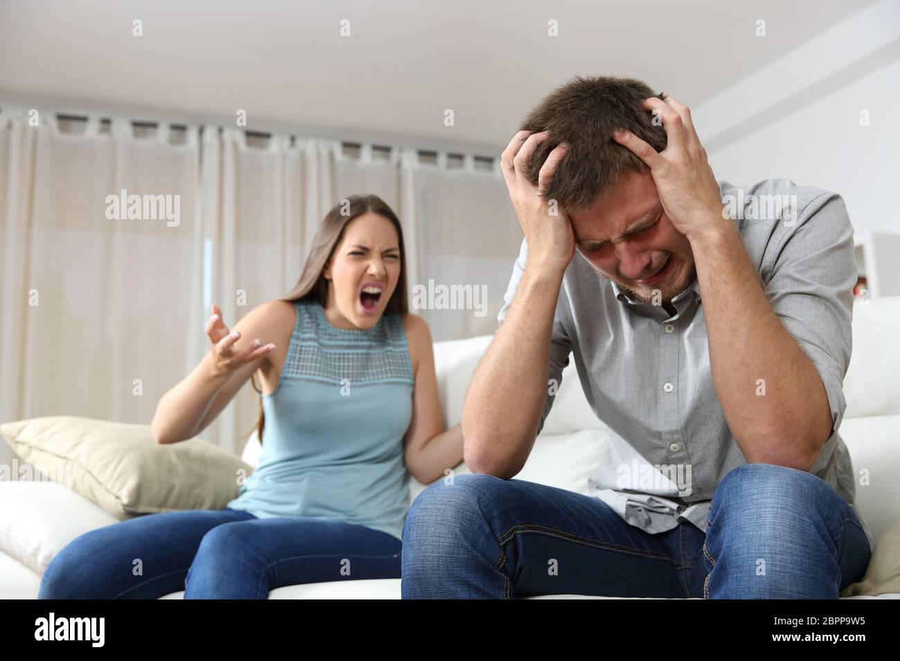 Couple woman crying on couch hi-res stock photography and images - Alamy