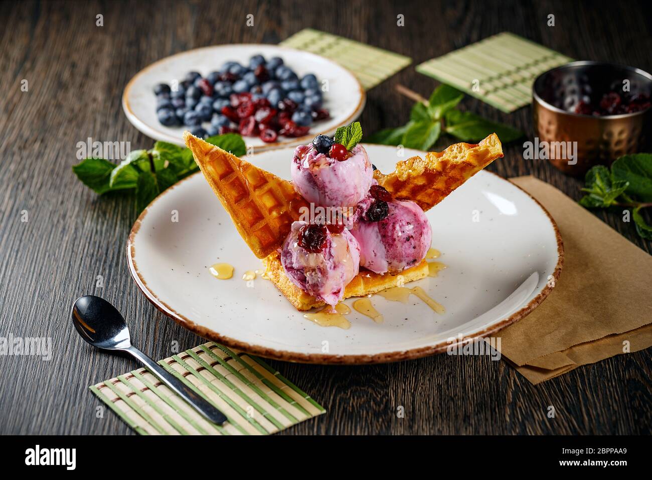 Waffle and forest fruit ice-cream with honey Stock Photo - Alamy