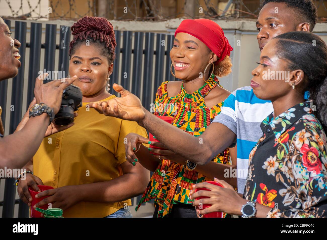 group of young african adults throwing a party, having a lot of fun, a ...