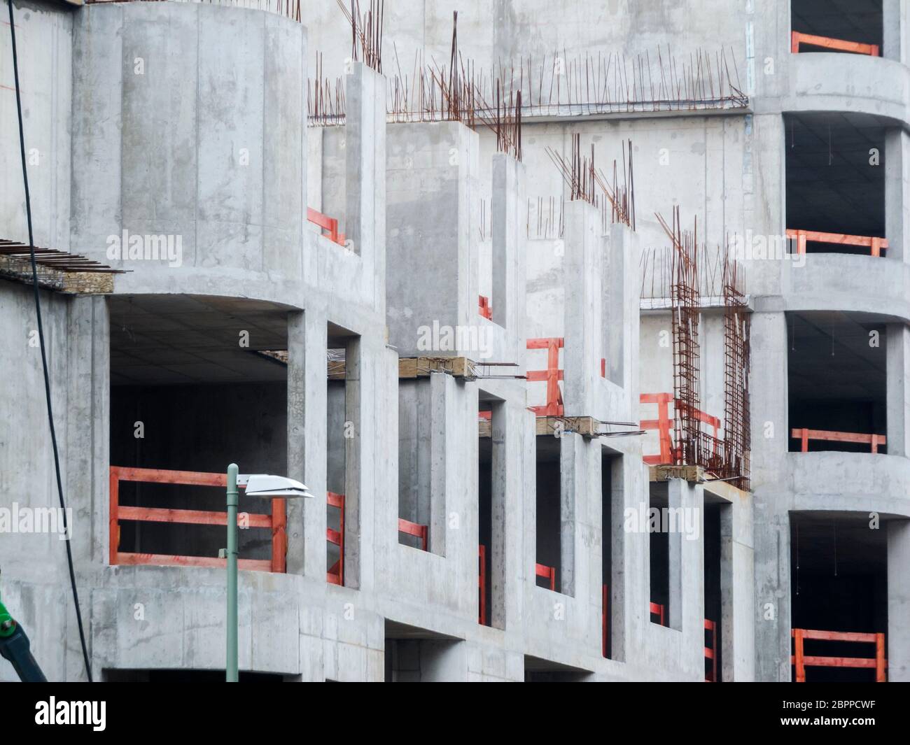 Concrete shell with free standing iron of a future office building in ...