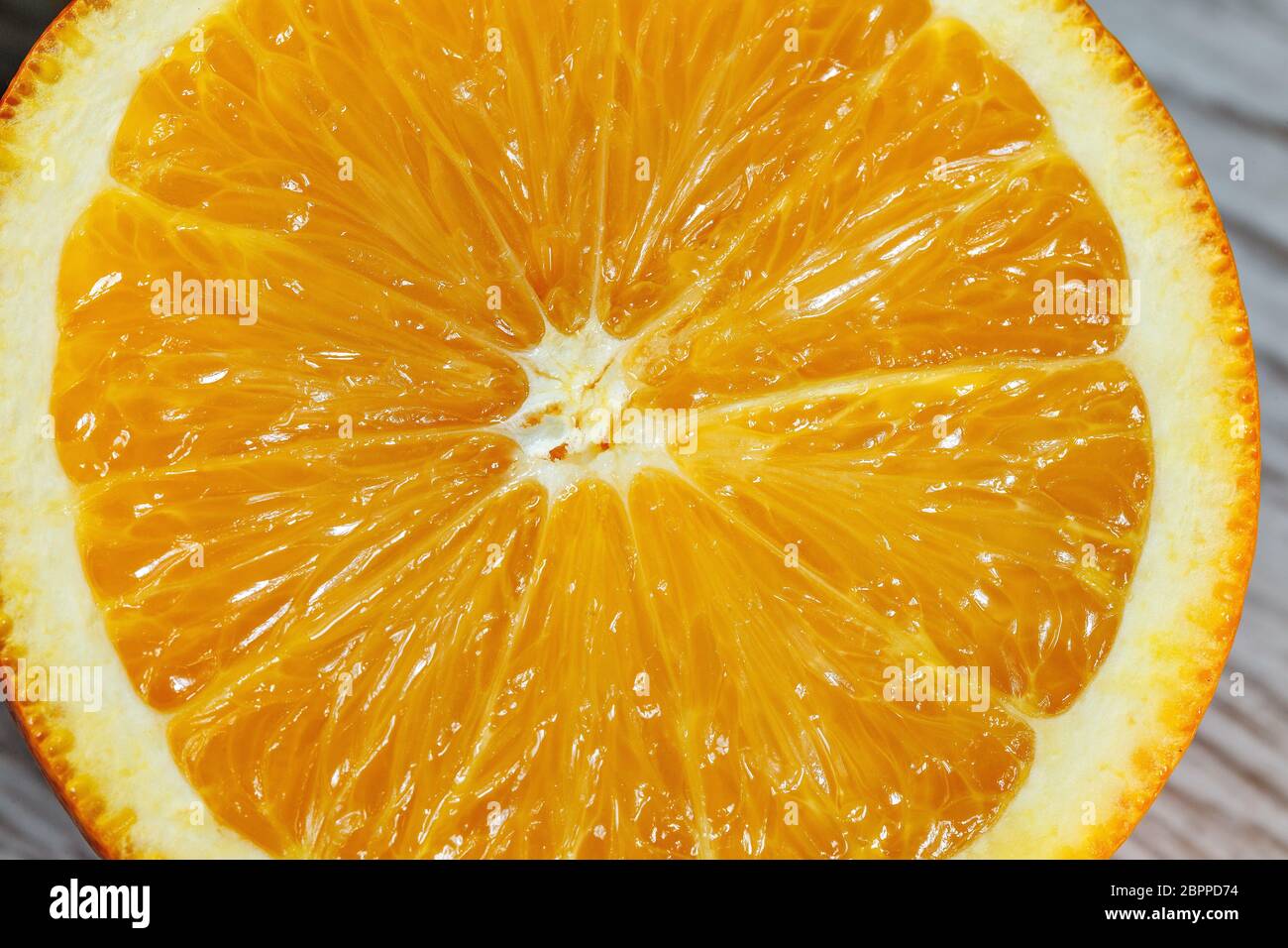 Orange in a cut close-up, piece of tropical fruit Stock Photo - Alamy